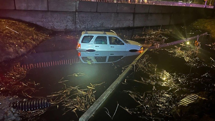 Car crashes into pond after driver has medical emergency