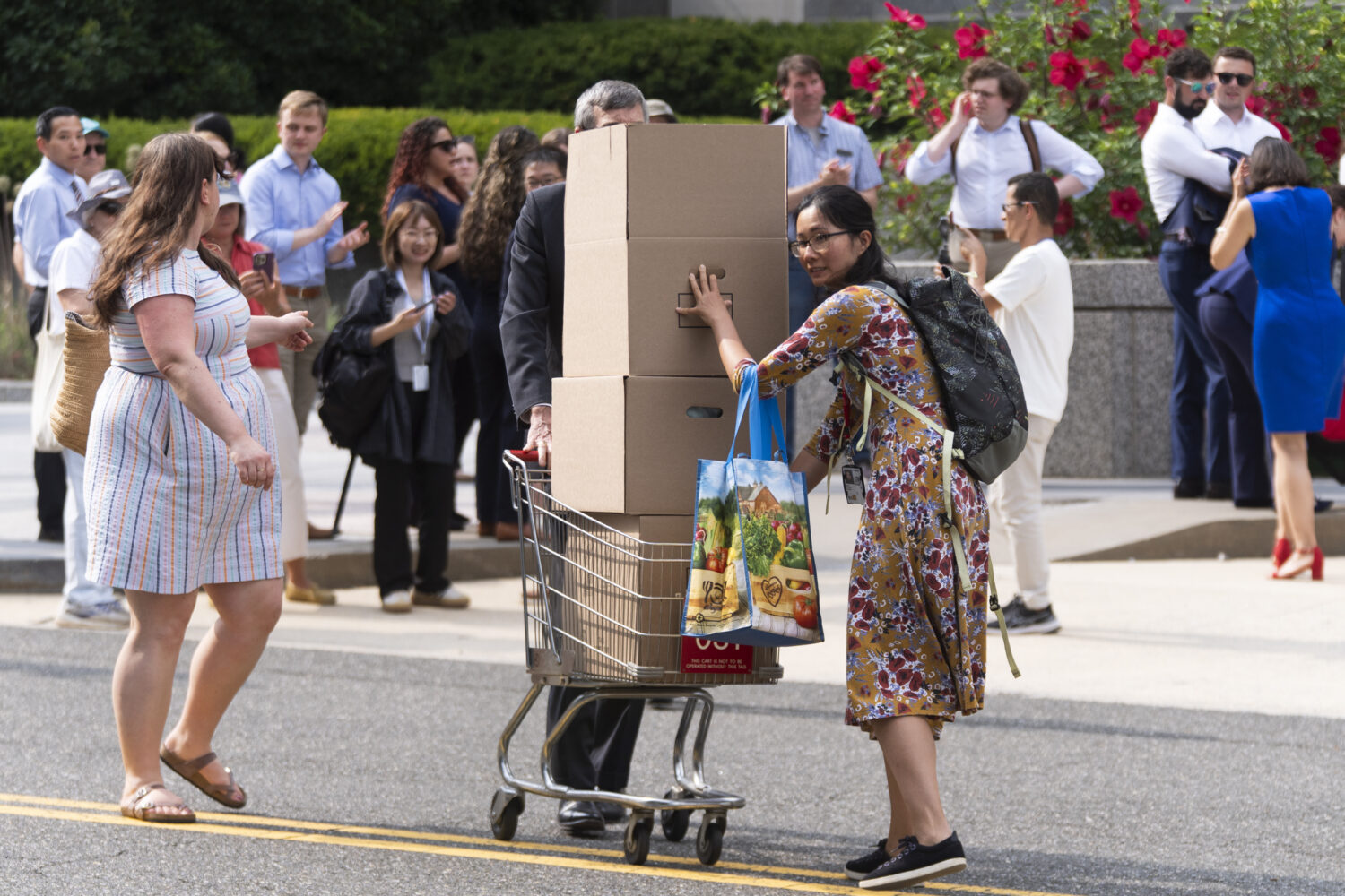 Photos of US State Department workers getting hugs and applause as they ...